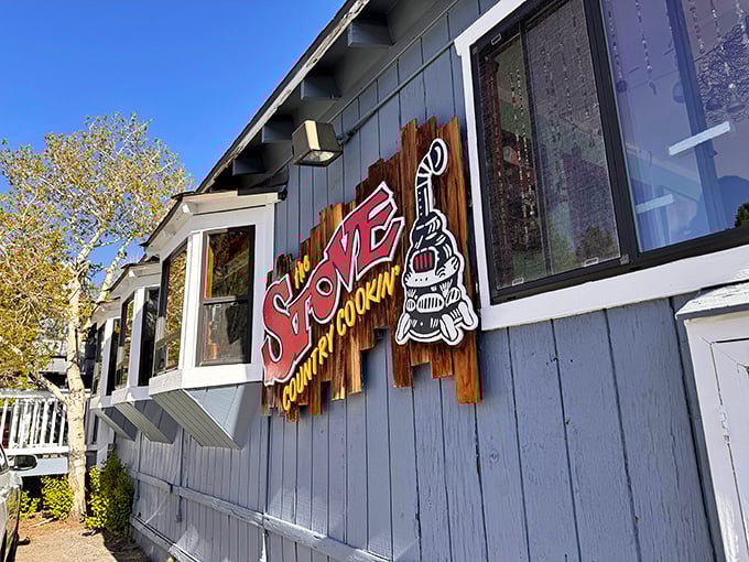 The blue clapboard exterior of The Stove stands like a breakfast beacon in Mammoth Lakes, promising mountain-sized portions and small-town charm.
