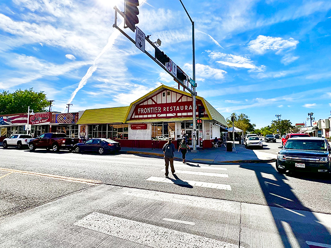 The iconic yellow and red A-frame beckons from Central Avenue like a culinary lighthouse, promising New Mexican treasures inside.