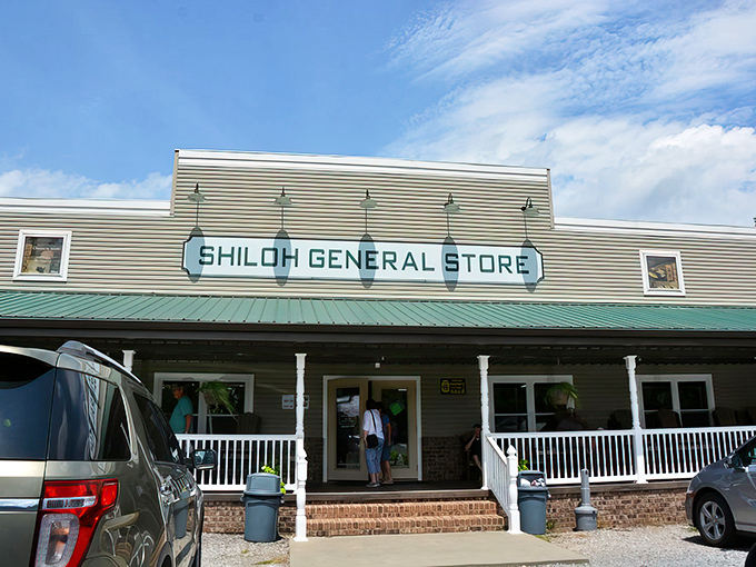 The welcoming facade of Shiloh General Store stands proudly against a brilliant blue North Carolina sky, its wide porch practically whispering "slow down and stay awhile."