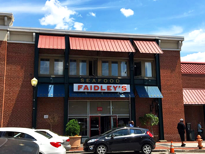 The brick facade of Faidley's stands like a seafood shrine in Baltimore, its vintage sign promising treasures from the Chesapeake that have delighted generations.