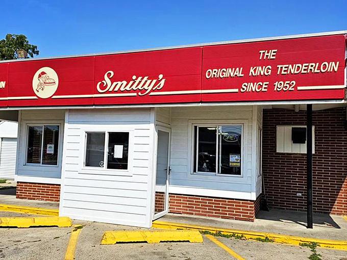 The bright red awning of Smitty's proudly announces "The Original King Tenderloin Since 1952"&mdash;a culinary landmark that's been perfecting pork longer than most of us have been eating it.