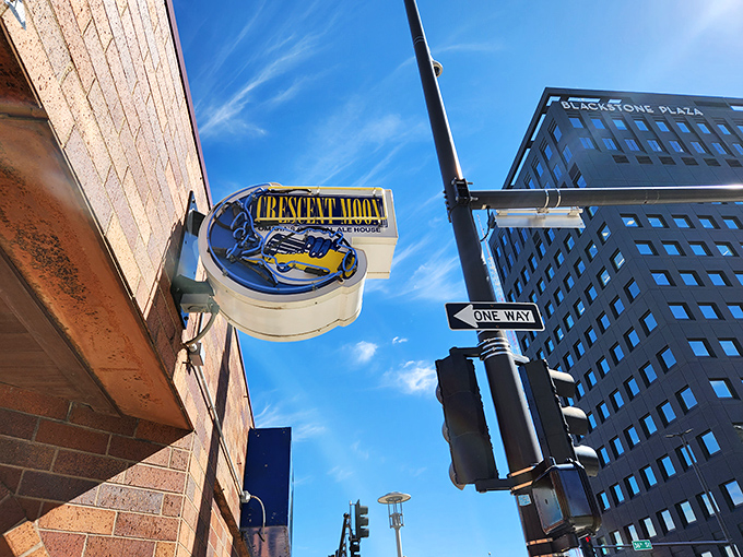 The brick exterior of Crescent Moon beckons like a culinary lighthouse, its blue moon sign promising delicious adventures within Omaha's Blackstone District. 