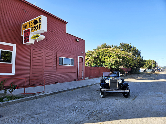 The iconic red exterior of Hitching Post stands like a beacon in tiny Casmalia, promising carnivorous delights that have drawn pilgrims for generations.