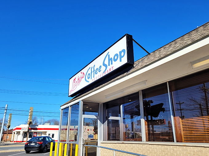 The iconic Lucky's sign welcomes hungry patrons like a beacon of breakfast hope. No fancy facade needed when what's inside is this good.