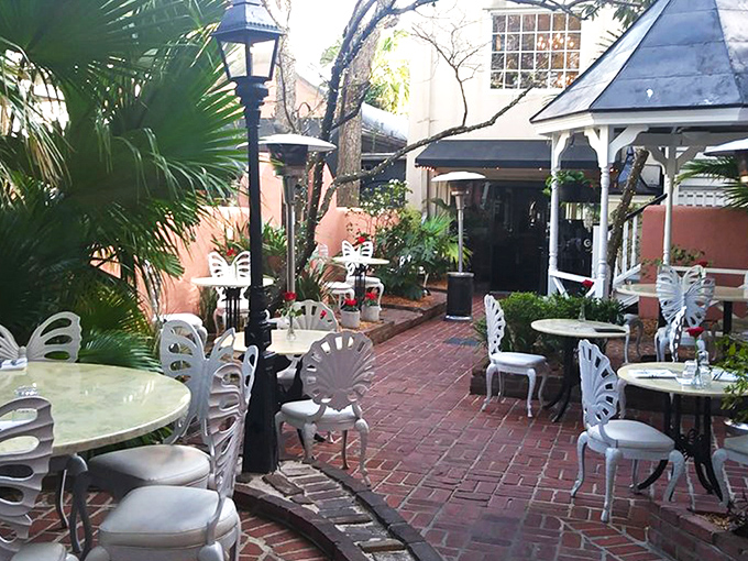 The courtyard at 82 Queen feels like Charleston's best-kept secret&mdash;a lush oasis where palm fronds and wrought-iron chairs conspire to make time slow down deliciously.