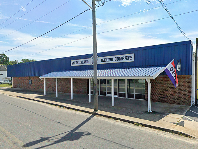 The blue-fronted bakery stands like a beacon of sweetness in Crisfield, promising layer upon layer of Maryland tradition behind those glass doors.