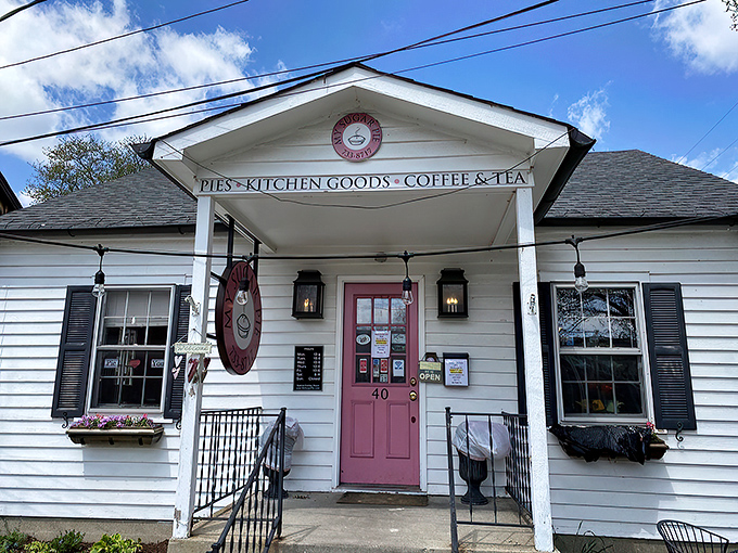 The white cottage with that irresistible pink door isn't just inviting&mdash;it's practically daring you to come inside and indulge.