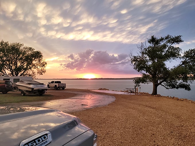 Nature's perfect meditation spot: where Kansas beach meets crystal waters, creating a moment of zen that no spa could replicate.