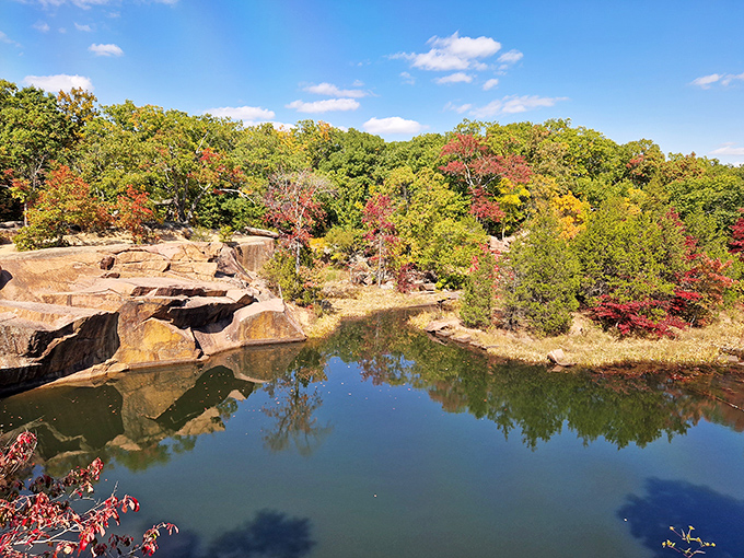 Nature's sculpture garden spans the horizon, where billion-year-old pink granite boulders rest like gentle giants against Missouri's emerald landscape.