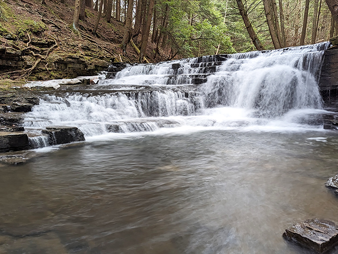 Nature's perfect waterfall tableau &ndash; where rushing water meets ancient rock in a dance that's been performing for millennia without ever taking a bow. 