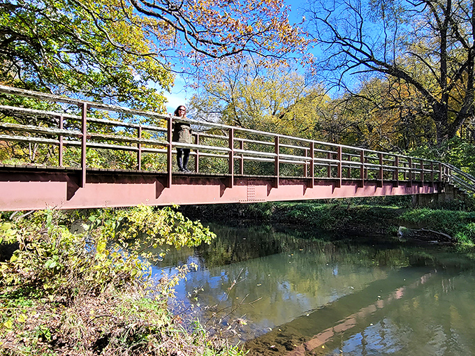 The bridge at White Pines stands like a miniature medieval fortress, where hiking trails and daydreams converge above Pine Creek's gentle flow.