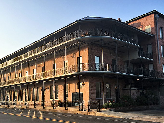 Front Street's historic charm on full display, where brick-paved streets and wrought-iron balconies create Louisiana's most walkable small-town downtown.