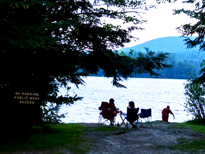 Mirror, mirror on the pond! Pillsbury's glassy waters create perfect reflections of autumn's fiery palette, nature's own Instagram filter at work.