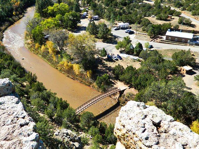 Nature's grand theater unfolds at Villanueva, where sandstone cliffs stand like ancient sentinels guarding the verdant valley below.