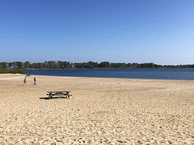 The sandy shores of Presque Isle Beach 11 stretch out like nature's welcome mat, offering a rare combination of lakeside tranquility and room to breathe.