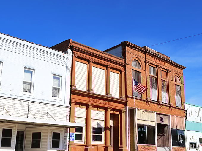 Colorful tiny shops at Down A Country Road create a garden oasis where Amish crafts find their showcase amid blooming flowers and comfortable seating areas. 