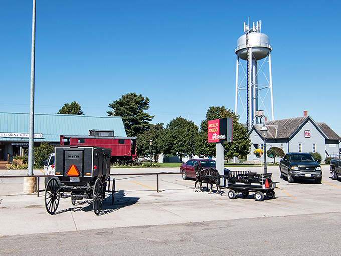 Where time travels at eight miles per hour. Amish buggies with their iconic orange safety triangles share the road with modern vehicles in Shipshewana.