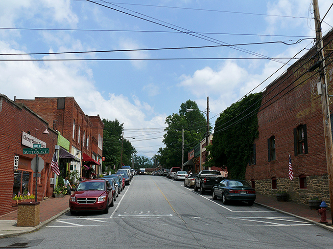 Downtown Black Mountain welcomes visitors with its classic small-town charm, where brick buildings frame picture-perfect mountain views in the distance.