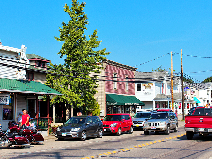 Where worlds collide: An Amish buggy shares the road with modern cars near Guggisberg Cheese Factory, while traditional haystacks dot the rolling hillside like nature's own artwork.