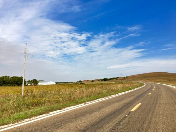 The road stretches toward infinity like nature's treadmill, minus the gym membership and with significantly better views.