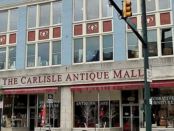 The iconic blue facade of The Carlisle Antique Mall stands proudly on Hanover Street, a time capsule waiting to be explored. 