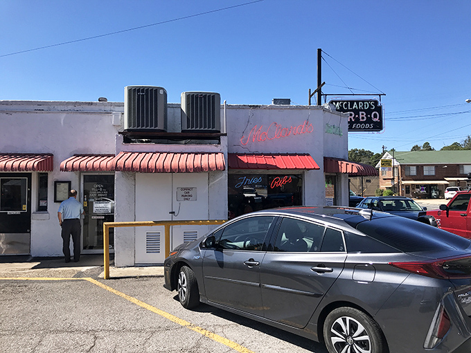 The humble white exterior of McClard's hides a smoky paradise within&mdash;proof that BBQ greatness doesn't need fancy architecture, just decades of dedication.