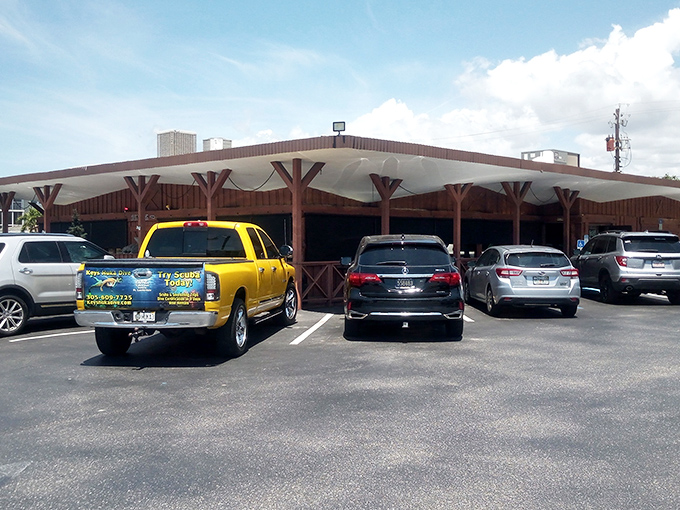 The rustic wooden facade of Gold Rush BBQ beckons like a frontier outpost for hungry travelers. That star above the entrance? It's earned.