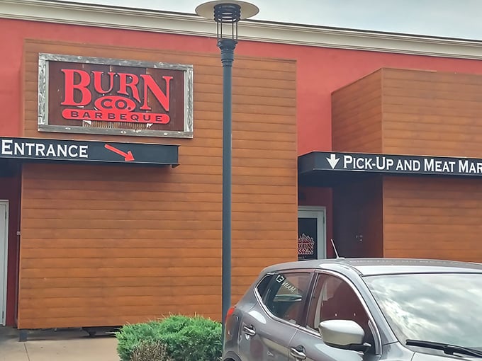 The wooden facade of barbecue paradise beckons with its bold red sign &ndash; a siren call to meat lovers that promises smoky delights within.