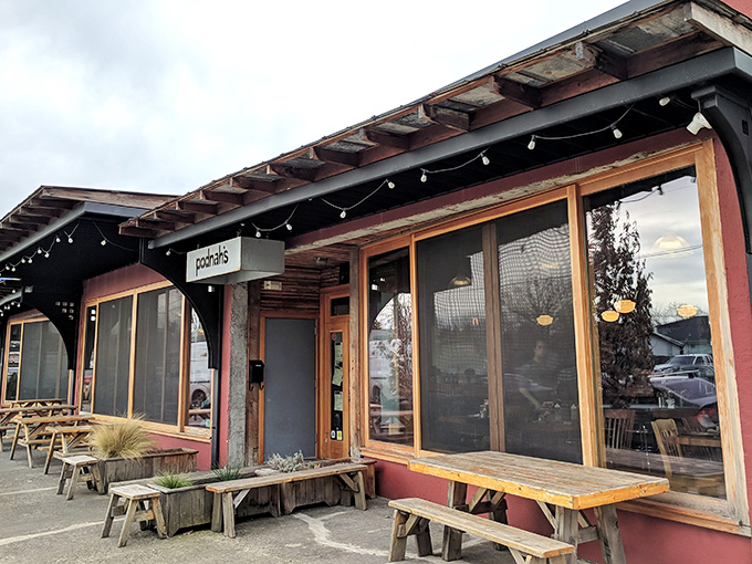 The entrance to barbecue nirvana, flanked by wood cages that aren't just decoration&mdash;they're the secret behind that intoxicating smoke aroma wafting through the neighborhood.
