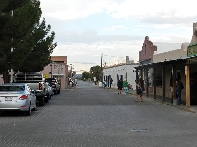The Organ Mountains create a dramatic backdrop for Mesilla's adobe buildings, like nature's own theatrical curtain for this historic stage.