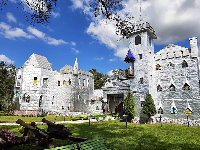 The shimmering facade of Solomon's Castle catches Florida sunlight like a medieval disco ball, complete with vibrant pink flowers that seem to bow in admiration.