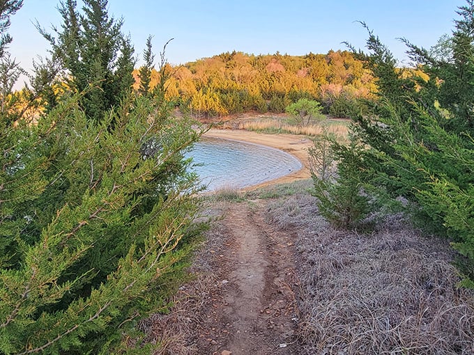 Nature's perfect meditation spot: where Kansas beach meets crystal waters, creating a moment of zen that no spa could replicate.
