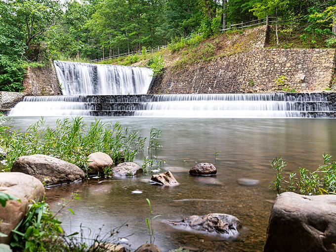 Mother Nature's perfection: crystal-clear mountain water meets rocky shores, all framed by the Allegheny Mountains' emerald embrace.