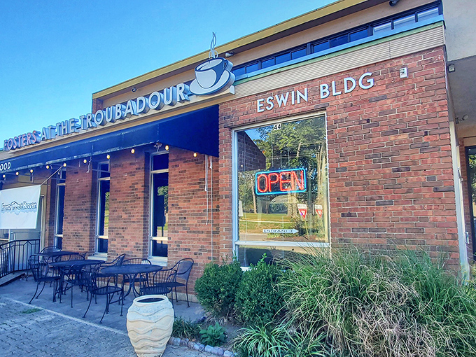 The unassuming storefront might fool you, but that chalkboard sign is basically a treasure map to breakfast nirvana.