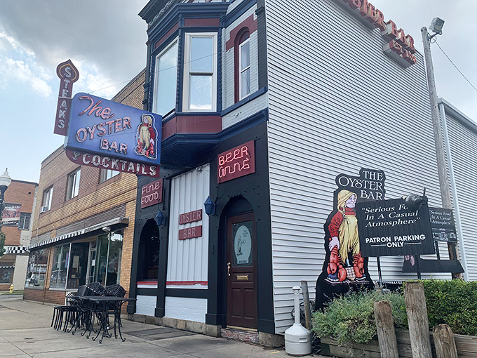 The Oyster Bar's iconic fa&ccedil;ade stands as a beacon of seafood excellence in downtown Fort Wayne, complete with vintage neon signage that whispers, "Yes, we've been doing this right for decades."