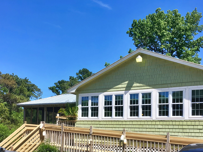The climb up these wooden steps feels like a pilgrimage to culinary heaven. Green-shingled charm awaits.