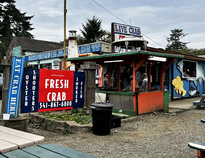 The colorful exterior beckons seafood lovers like a lighthouse calls to ships. Those vibrant picnic tables aren't just furniture&mdash;they're stages for impending seafood euphoria. 