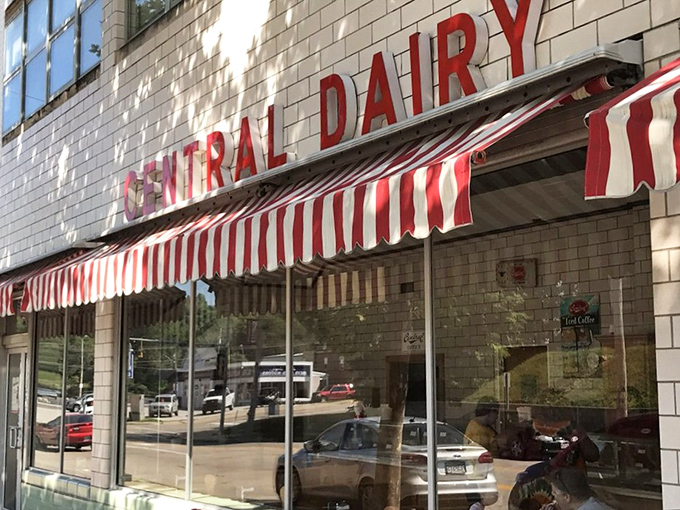 The iconic red-and-white striped awnings of Central Dairy beckon like a dessert lighthouse on Madison Street. Ice cream salvation awaits inside.