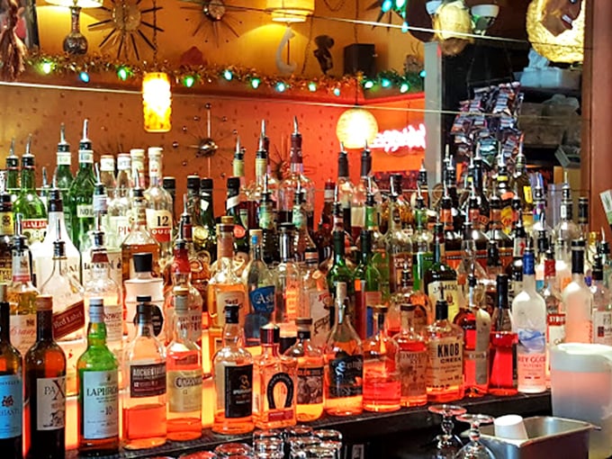 The bar doesn't just stock bottles; it curates liquid happiness, with amber spirits glowing like a museum exhibition dedicated to good times.