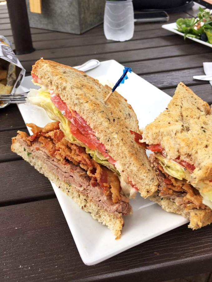 This isn't just a BLT &ndash; it's a towering achievement of bacon, lettuce, and tomato architecture with a side of potato salad that deserves its own fan club.