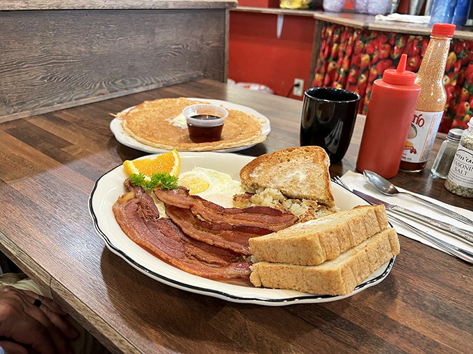 The breakfast that launched a thousand road trips. Thick-cut bacon, farm-fresh eggs, and that legendary molasses bread&mdash;morning perfection on a plate.
