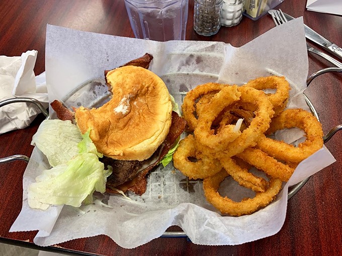This isn't just a burger with onion rings&mdash;it's edible architecture, a testament to the beauty of simple ingredients handled with respect.