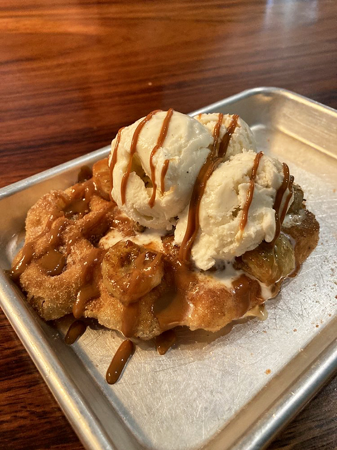 Two scoops of ice cream melting into caramelized waffle valleys. This isn't dessert&mdash;it's an edible work of art with a side of joy.