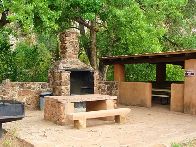This isn't just a picnic area&mdash;it's an outdoor dining room with a stone fireplace that would make any home designer jealous.