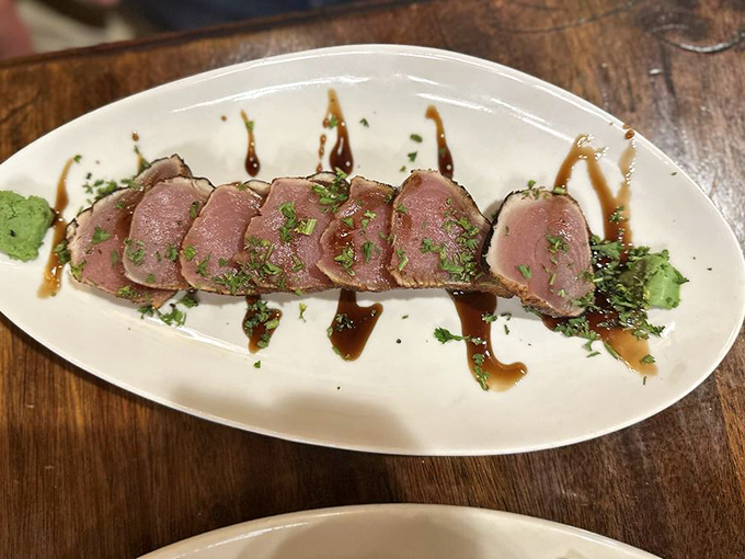 Perfectly seared salmon rests atop a cloud of mashed potatoes &ndash; simplicity executed with the kind of skill that makes you close your eyes in appreciation.