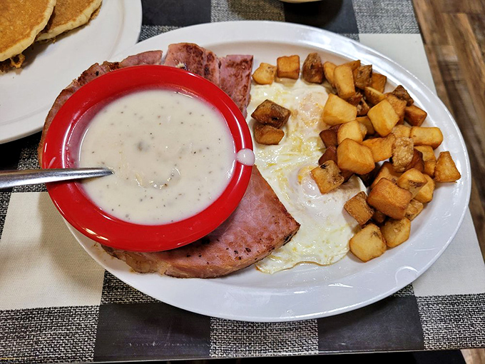 The breakfast that says "Take your time, the day can wait." Country ham, eggs, and gravy—the holy trinity of morning satisfaction.