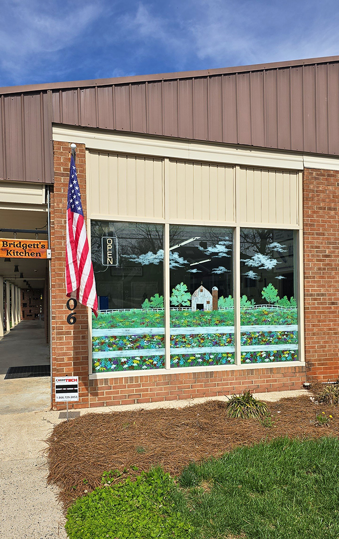 Bridgett's Kitchen's patriotic display and charming window art hint at the homestyle comfort waiting inside this local favorite.