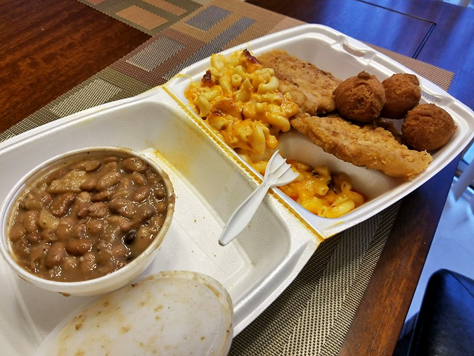 This plate could make anyone homesick for a Southern kitchen they never even had—pork, mac and cheese, and hush puppies in perfect harmony.