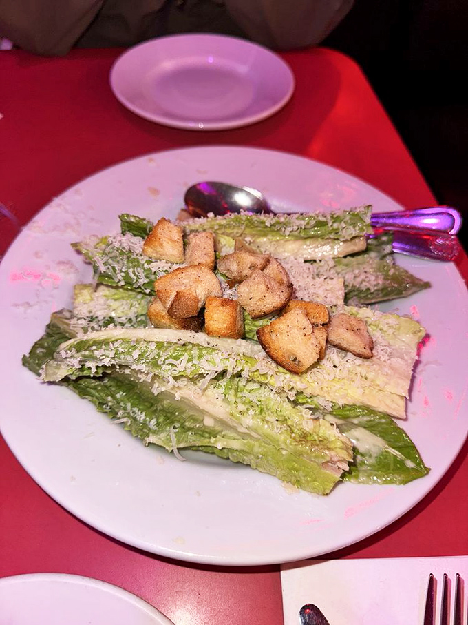 A Caesar salad that proves vegetables can hang with the cool kids when properly dressed in parmesan and crunchy croutons.