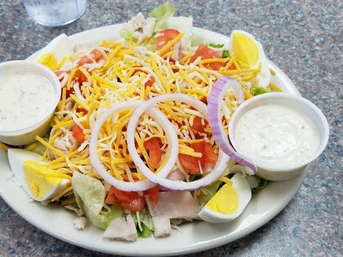 A chef salad that doesn't apologize for being a salad. Generous cheese, eggs, and protein make this the rare salad that won't leave you hungry an hour later.
